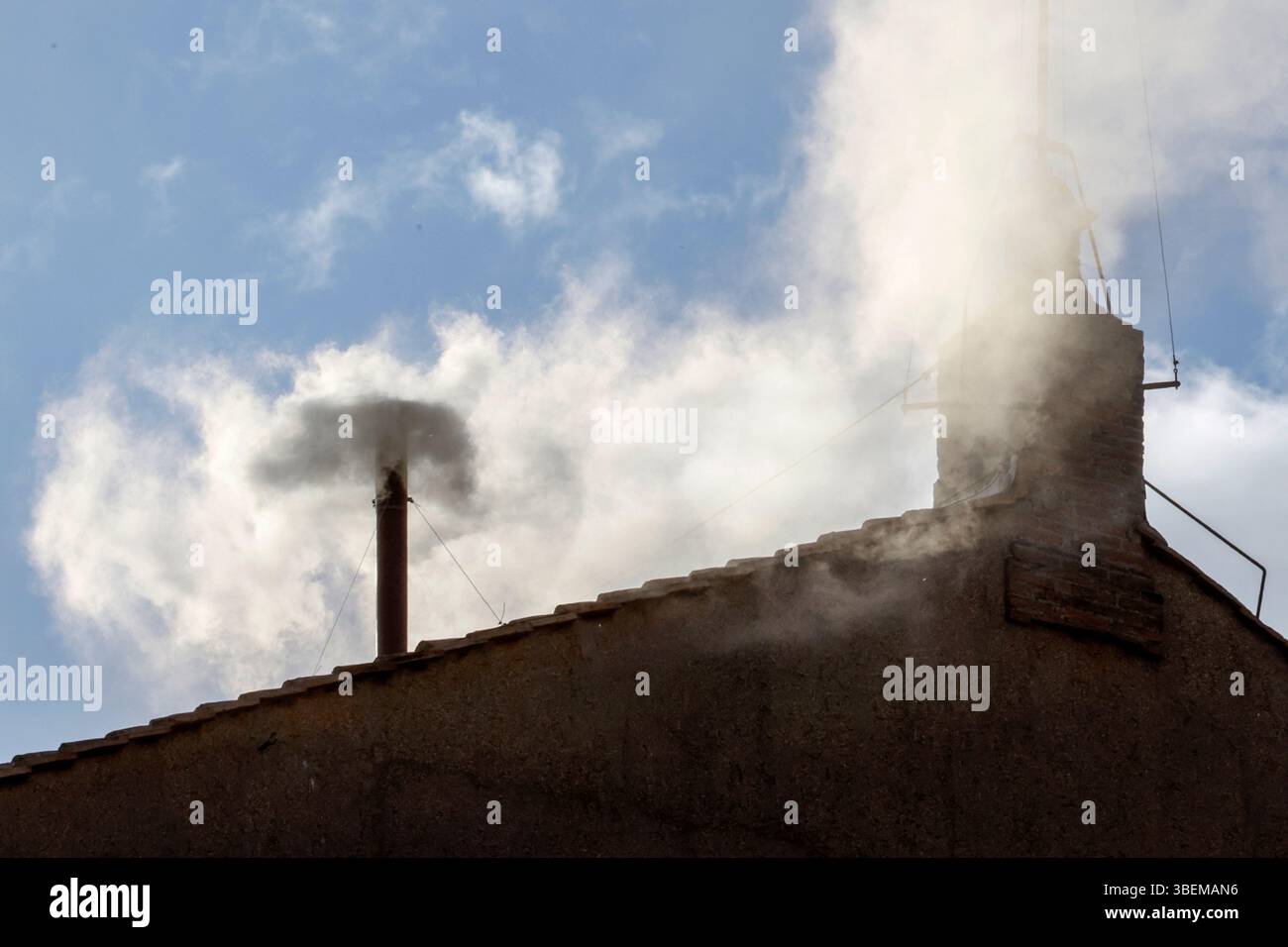 Vatican City, 8 May, 2025. White smoke emerges from the chimney atop ...