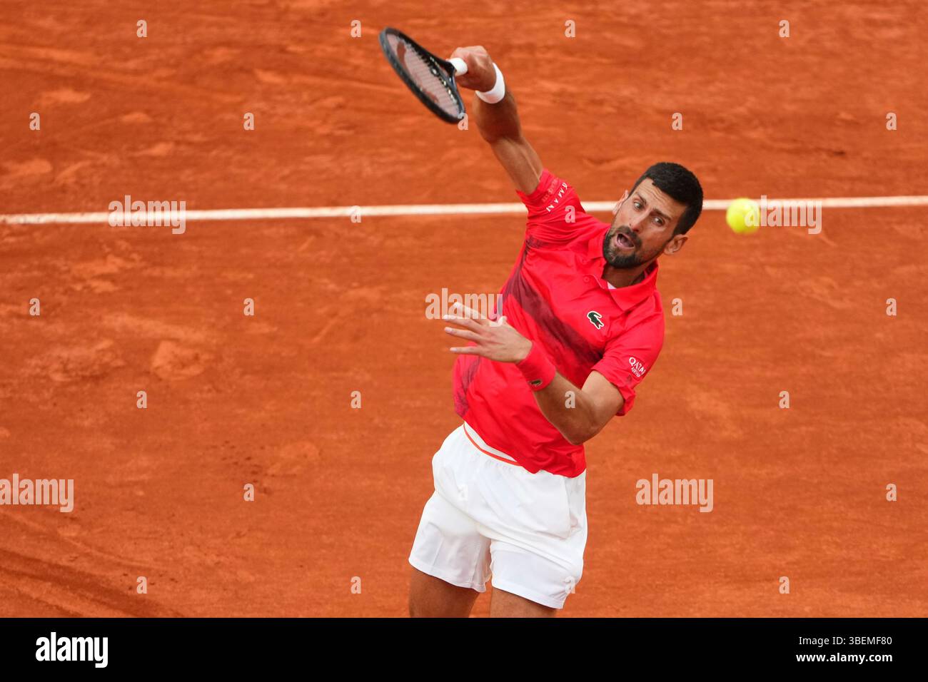 Serbia's Novak Djokovic serves against France's Corentin Moutet during their second round match ...