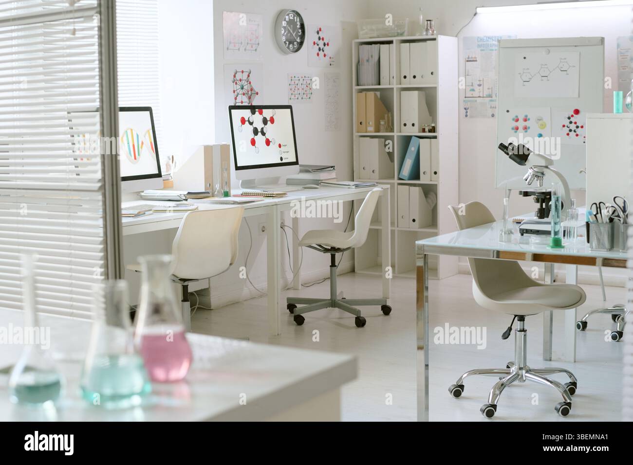 Contemporary laboratory setup with advanced equipment on white desks ...