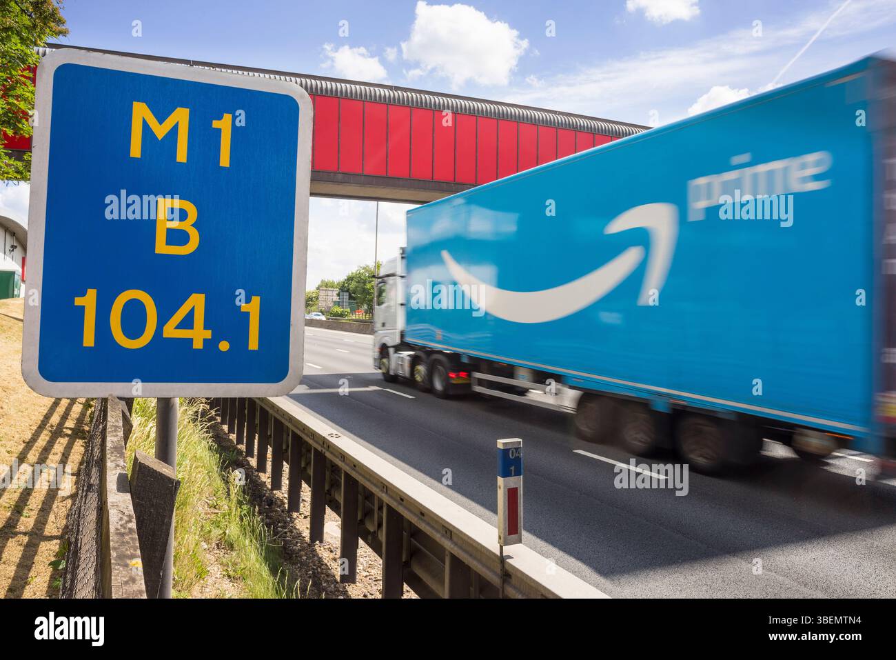 An Amazon Prime truck passes a Driver Location Sign alongside the M1 ...