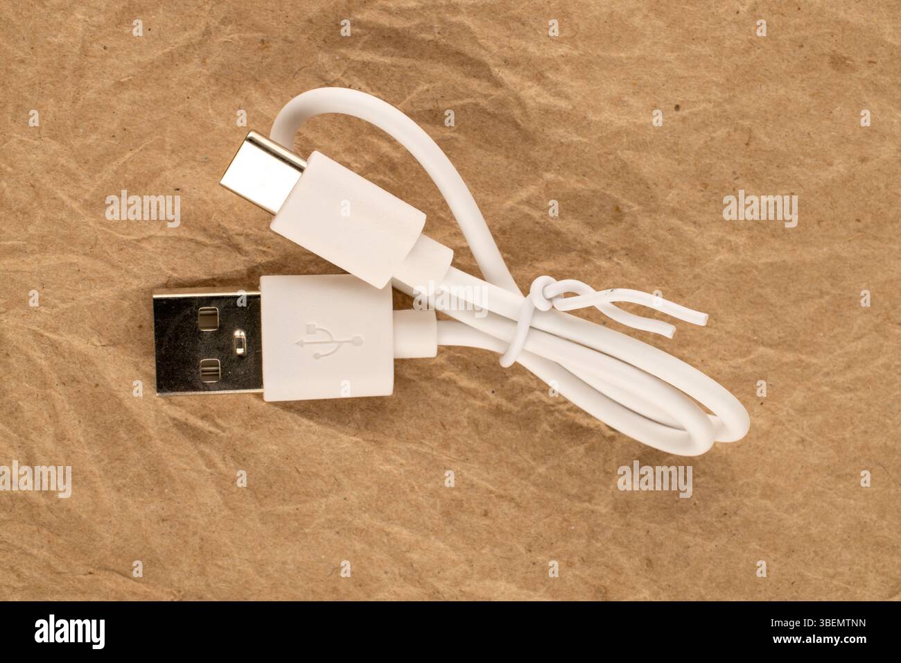 One USB cable on kraft paper, close-up, top view Stock Photo - Alamy