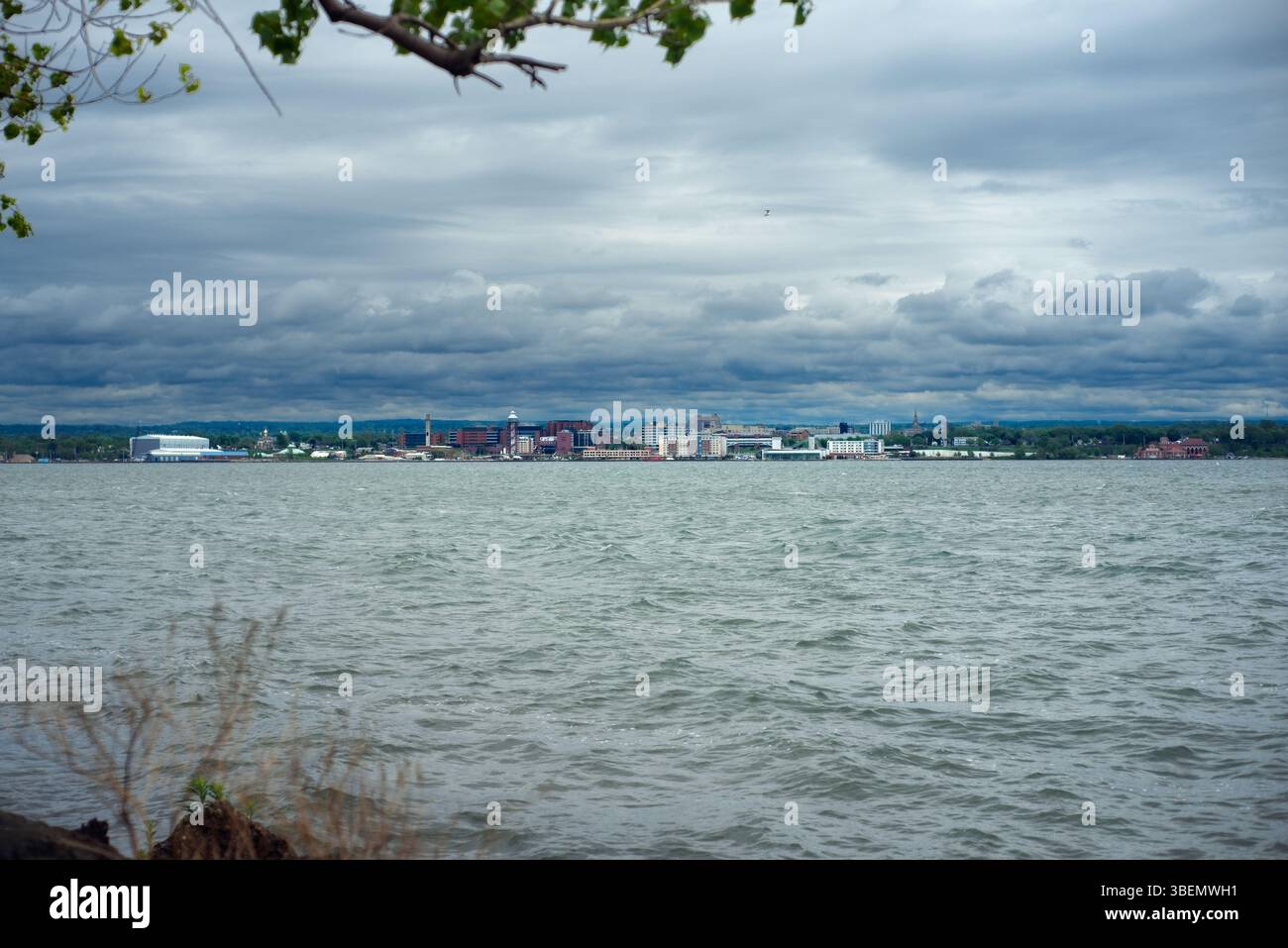 Distant view of downtown Erie Pennsylvania across Presque Isle Bay from ...