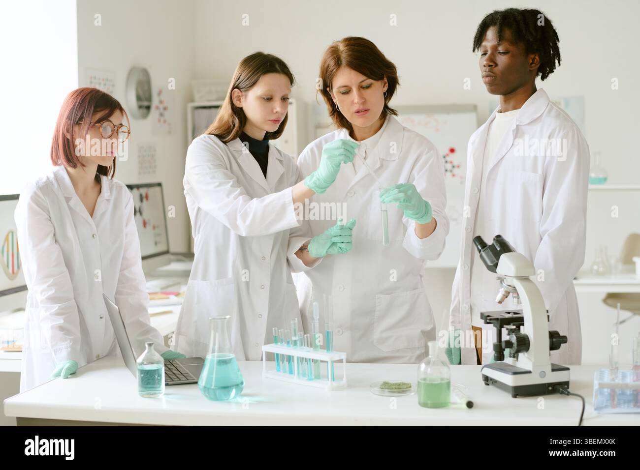 Group of scientists from diverse backgrounds conducting scientific ...