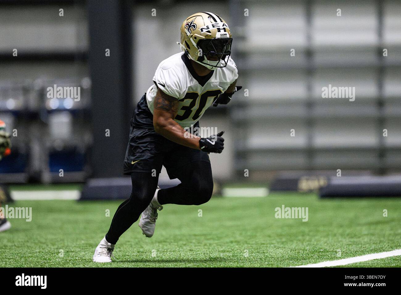 New Orleans Saints running back Devin Neal runs during NFL football ...