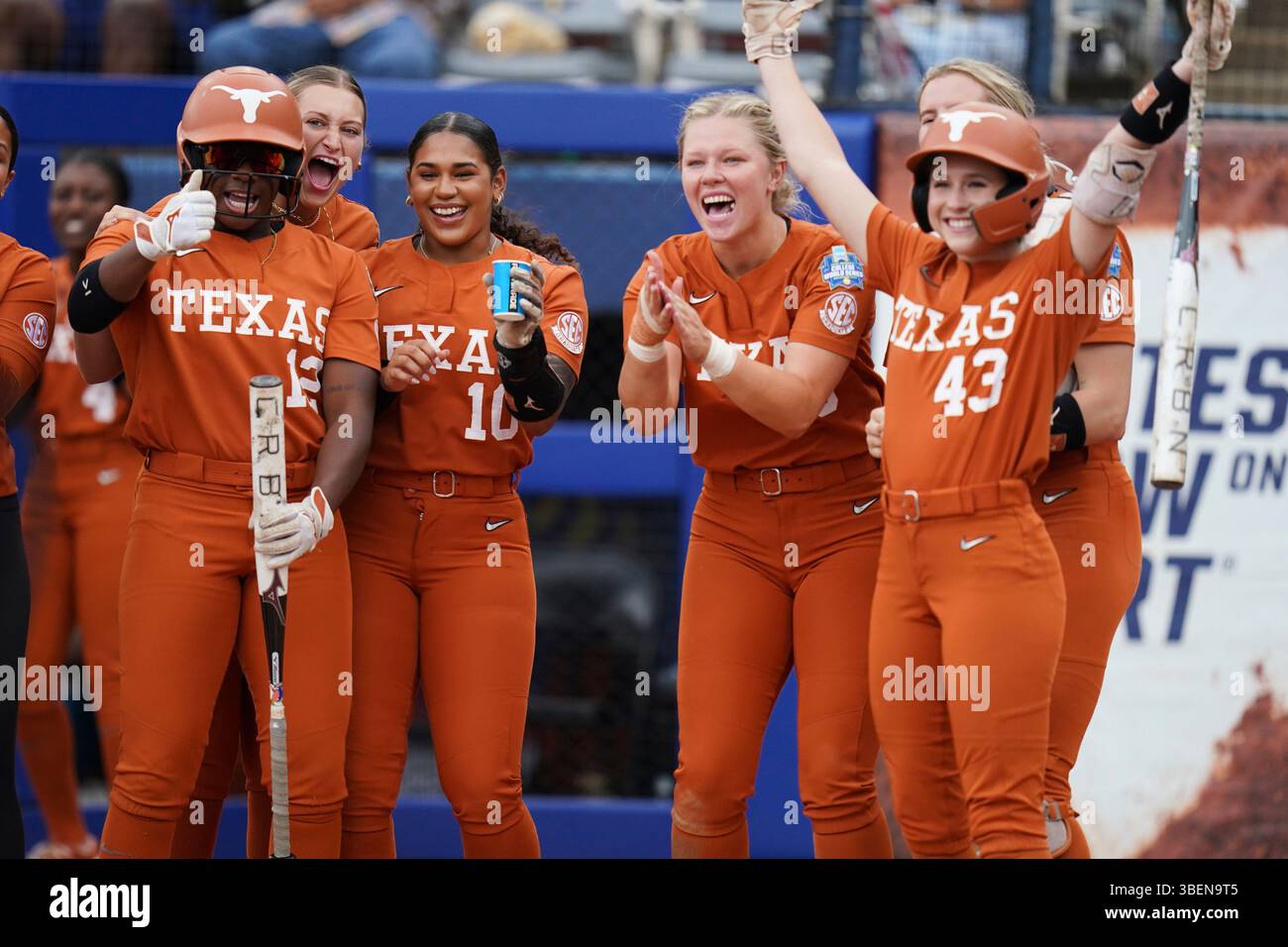 Teammates wait to greet Texas utility Katie Stewart (20) after she hits ...