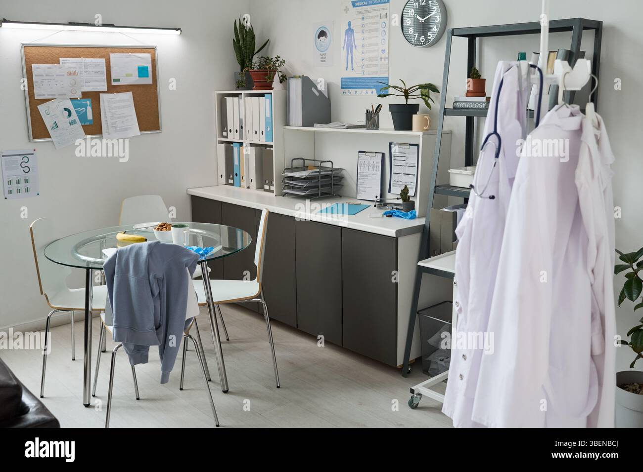 Medical office featuring organized workspace setup with documents and ...