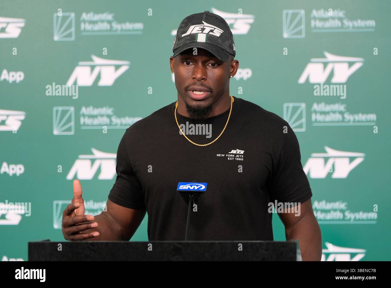 New York Jets special teams coordinator Chris Banjo talks to reporters ...