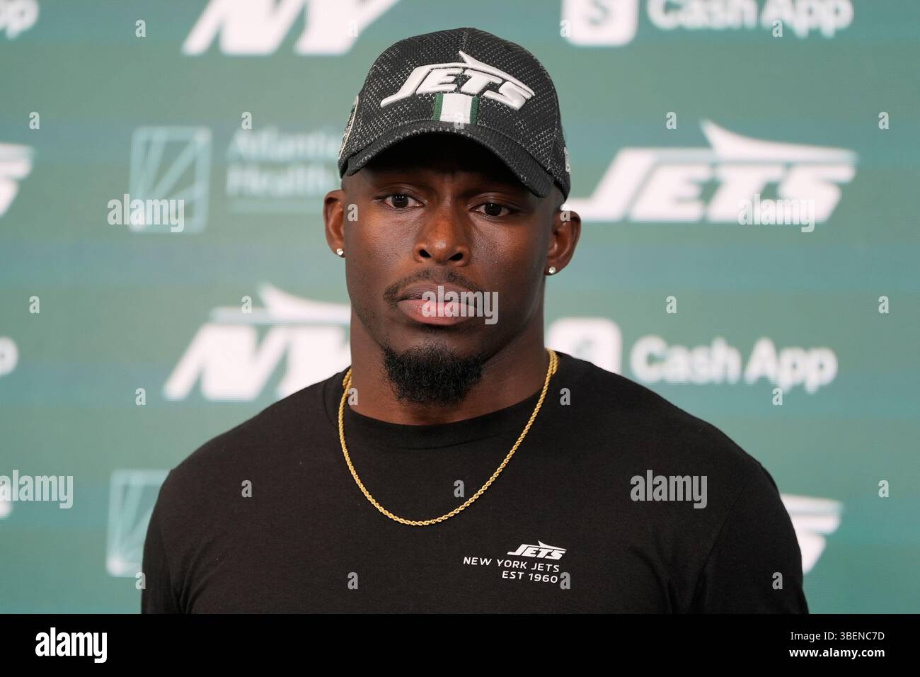 New York Jets special teams coordinator Chris Banjo talks to reporters ...