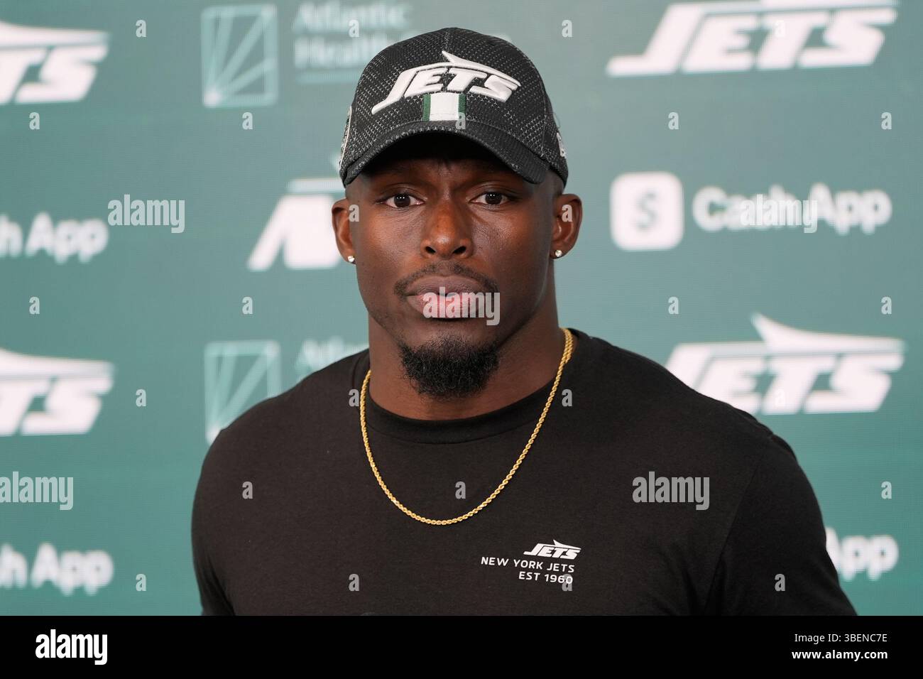 New York Jets special teams coordinator Chris Banjo talks to reporters ...