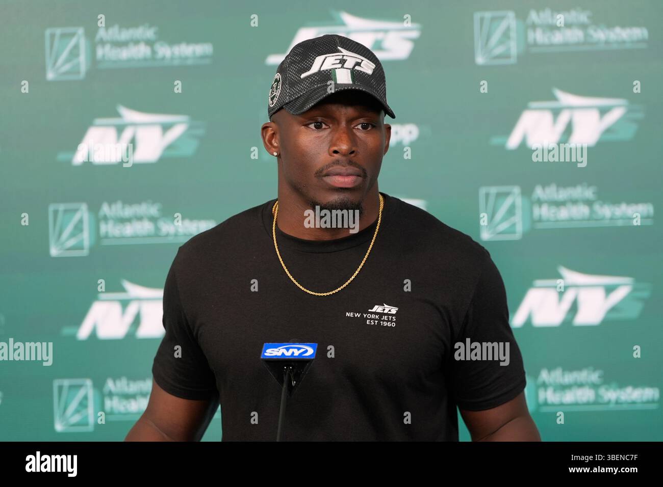 New York Jets special teams coordinator Chris Banjo talks to reporters ...