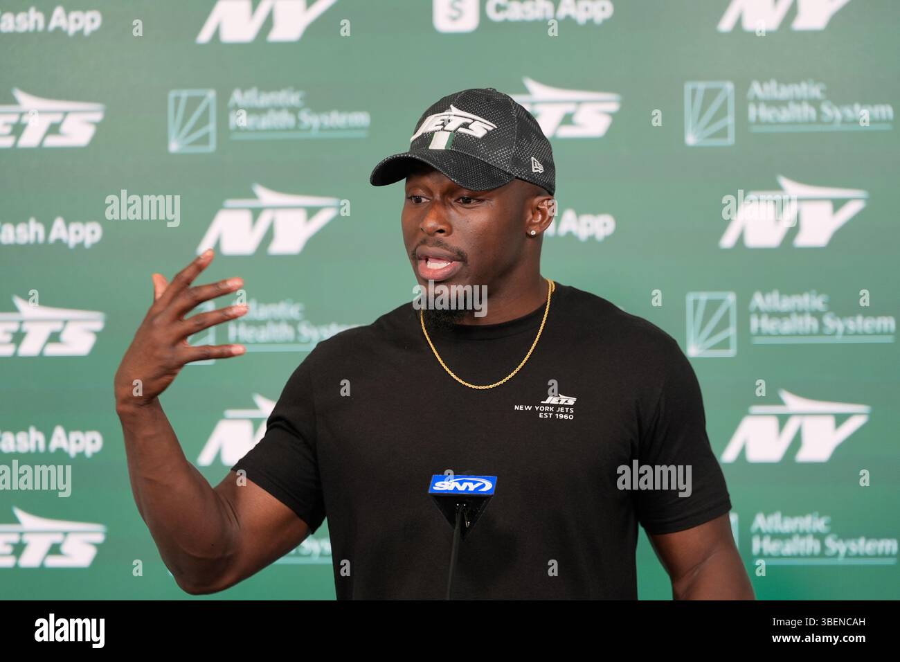 New York Jets special teams coordinator Chris Banjo talks to reporters ...