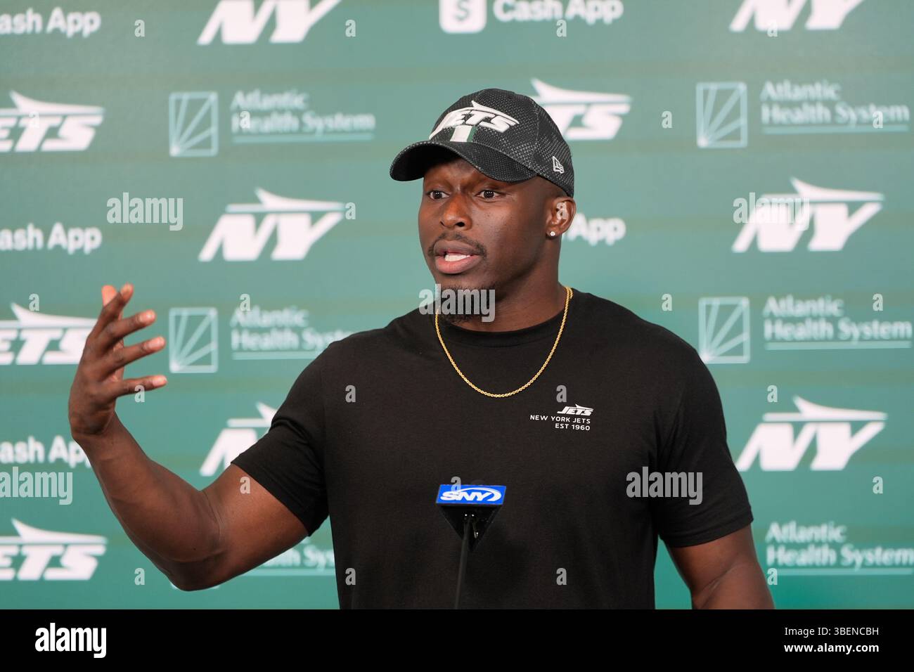 New York Jets special teams coordinator Chris Banjo talks to reporters ...