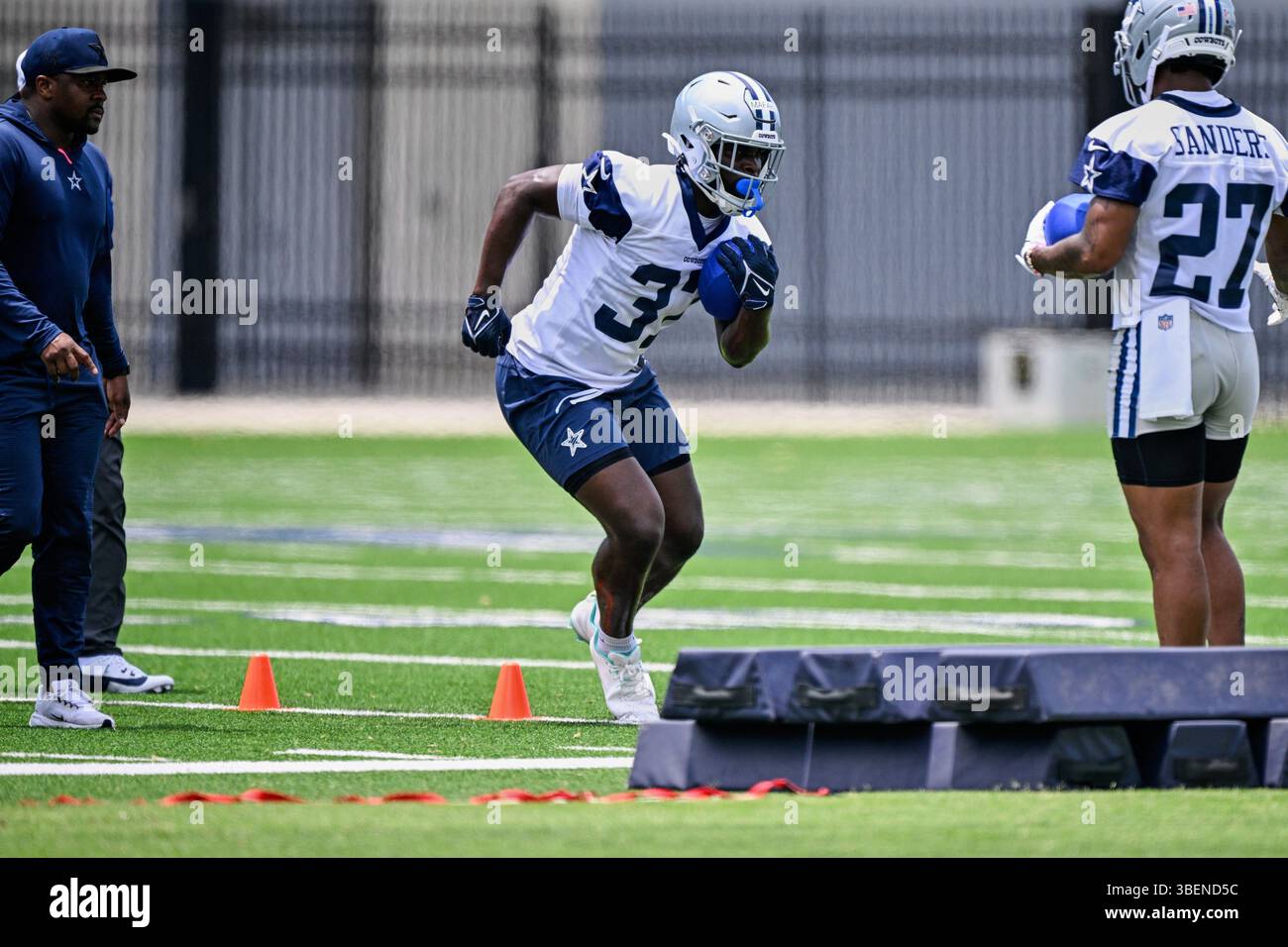 Dallas Cowboys' running back Phil Mafah runs a drill during NFL ...