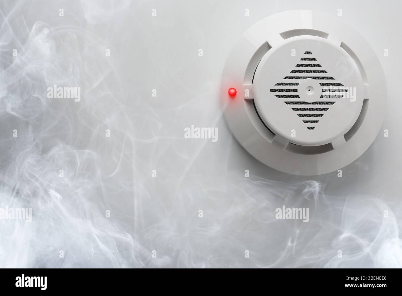 Fire alarm system. Detector on ceiling triggered by smoke, bottom view ...