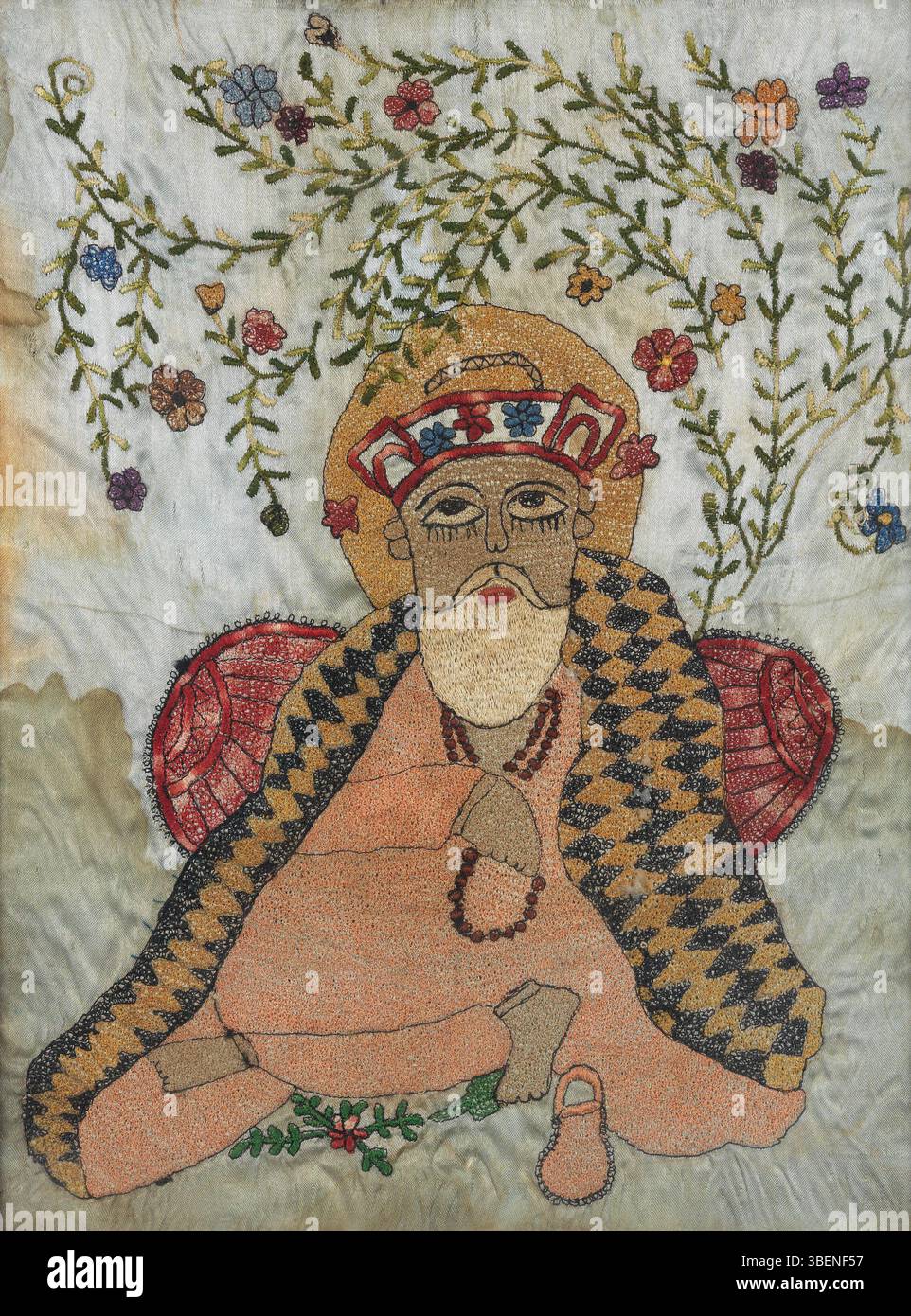 This embroidered silk panel depicts Guru Nanak, the founder of Sikhism ...