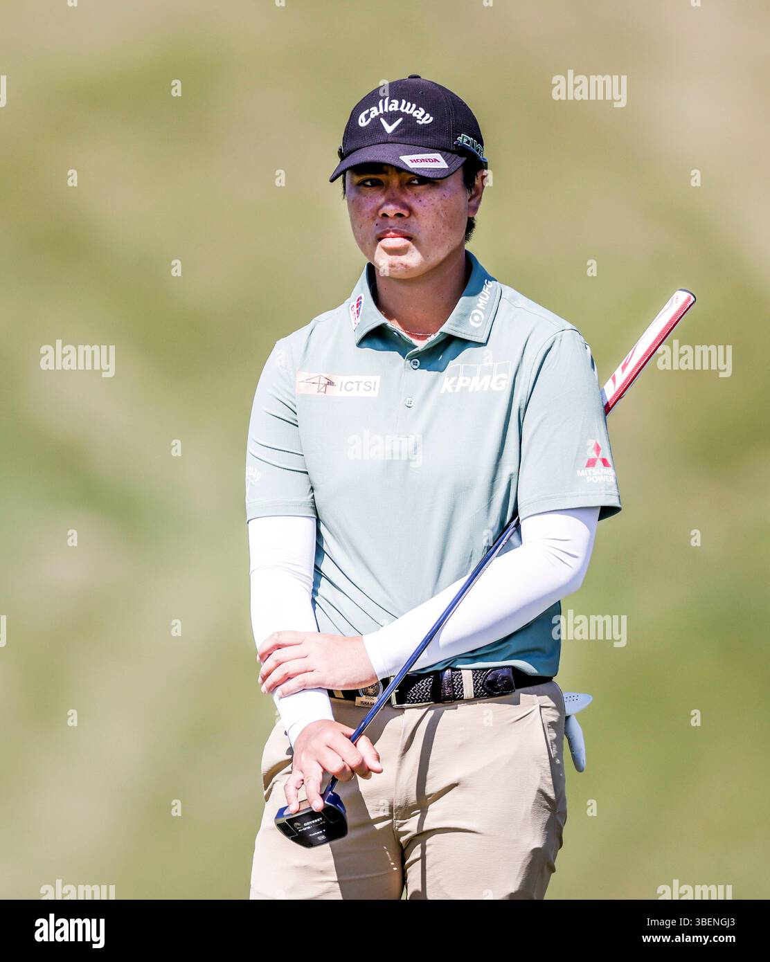 Yuka Saso of Japan waits for her turn to putt on the 18th green during ...