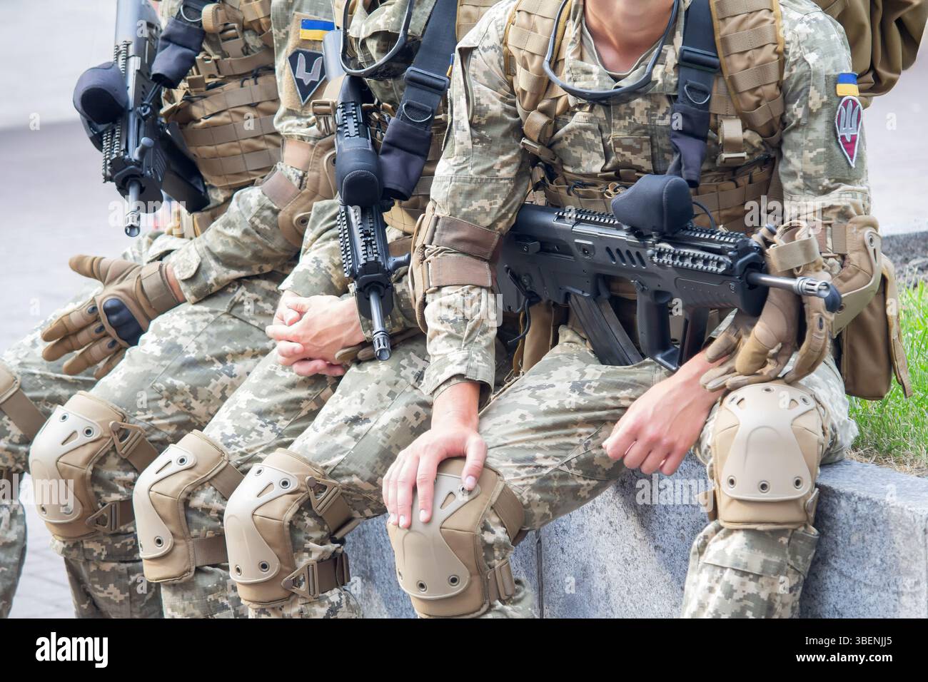 Modern assault rifles in the hands of Ukrainian army soldiers. Armed ...