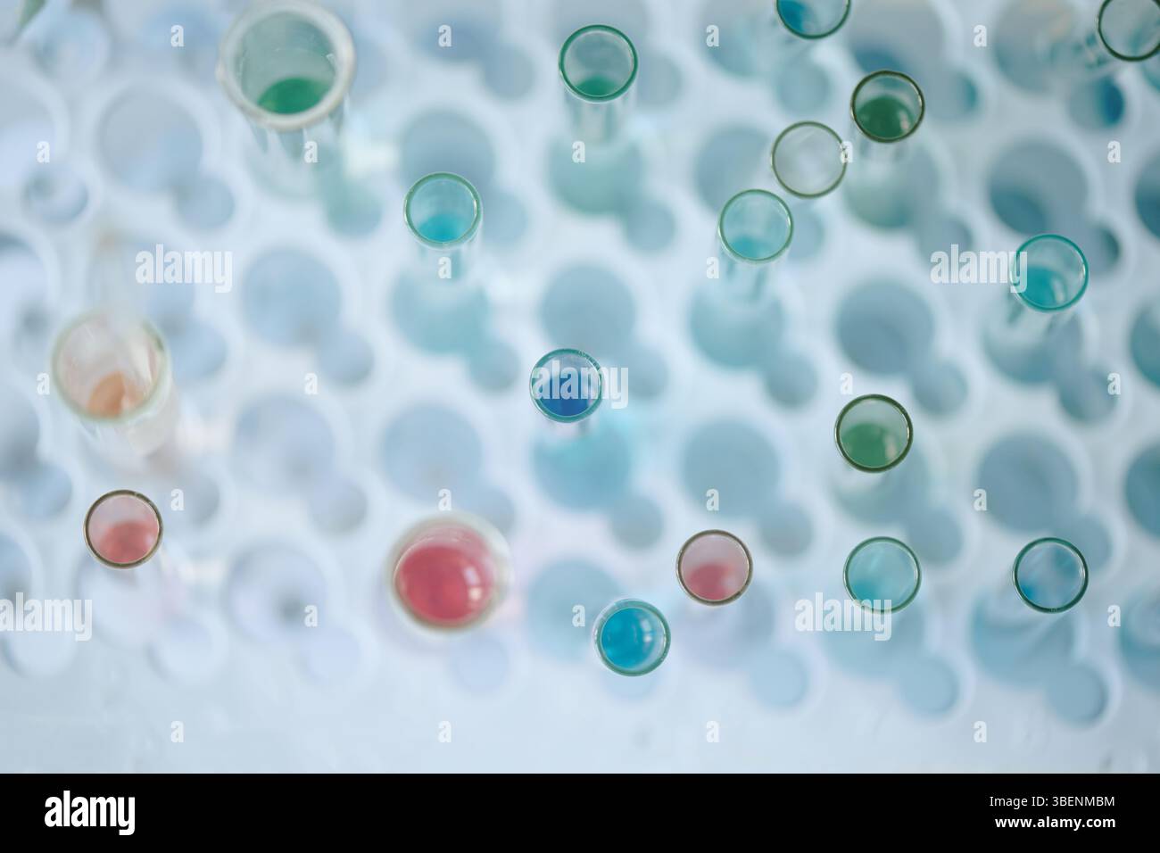 Test tubes of various colors placed in scientific laboratory ...