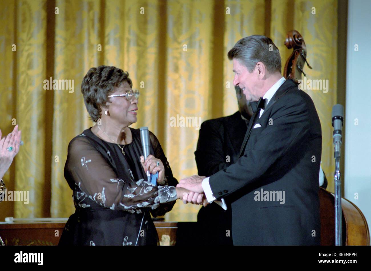 Ella Fitzgeralnd shaking hands with President Ronald Reagan after ...