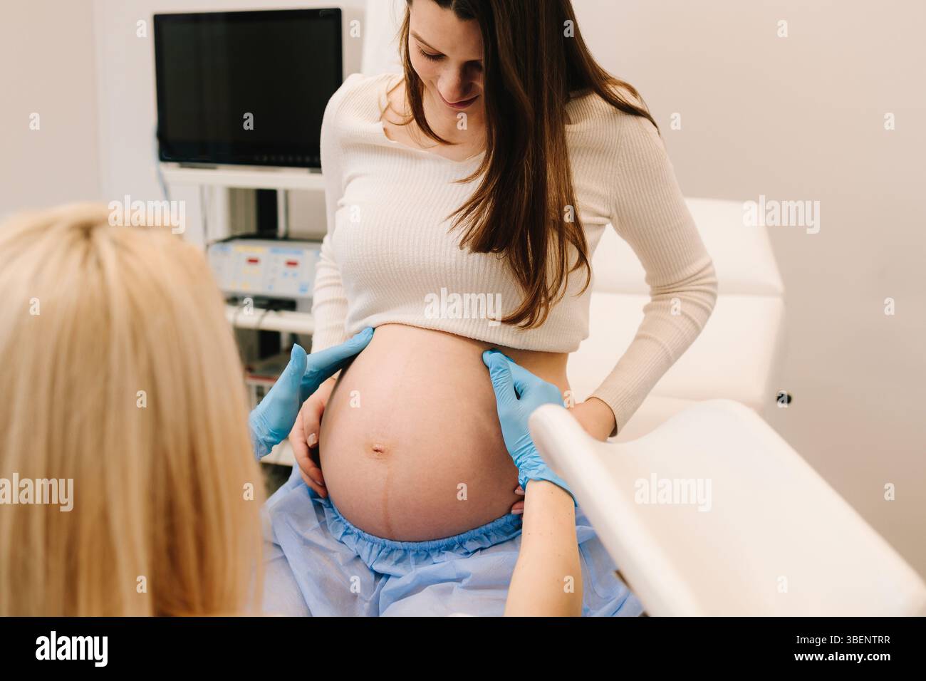 Palpation of womb belly, feeling baby fetus embryo bumps in gynecology ...