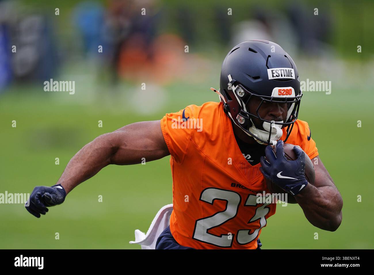 Denver Broncos running back Audric Estime takes part in drills during an NFL football team ...