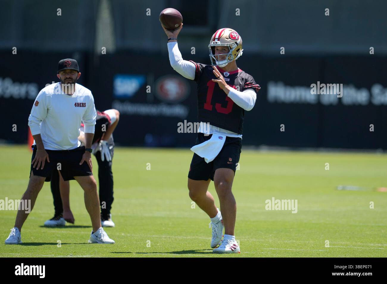 San Francisco 49ers quarterback Brock Purdy (13) throws a pass next to ...