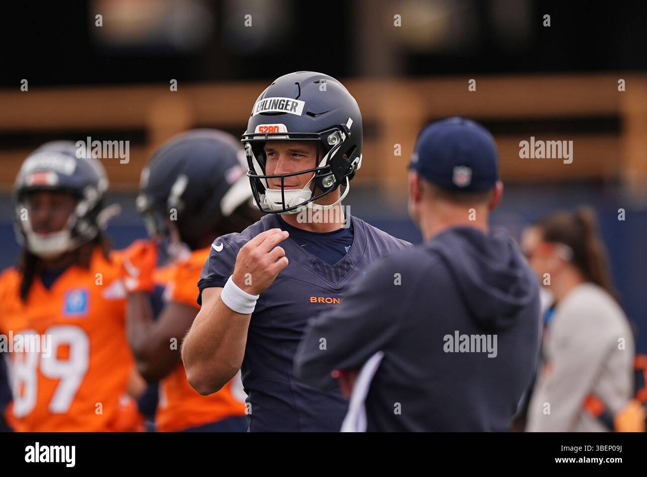 Denver Broncos quarterback Sam Ehlinger takes part in drills during an NFL football team ...