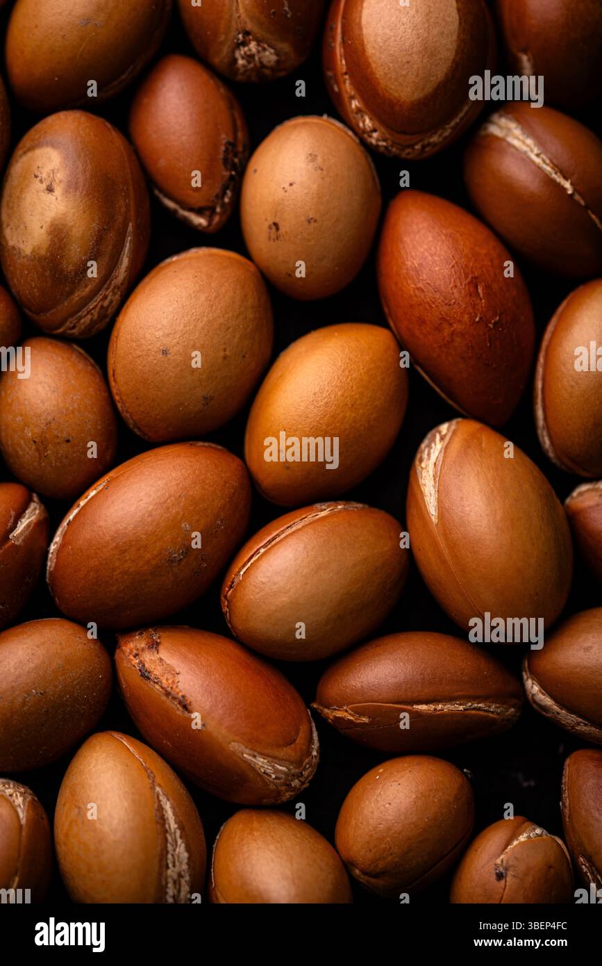 Close-up of brown macadamia nuts background Stock Photo - Alamy