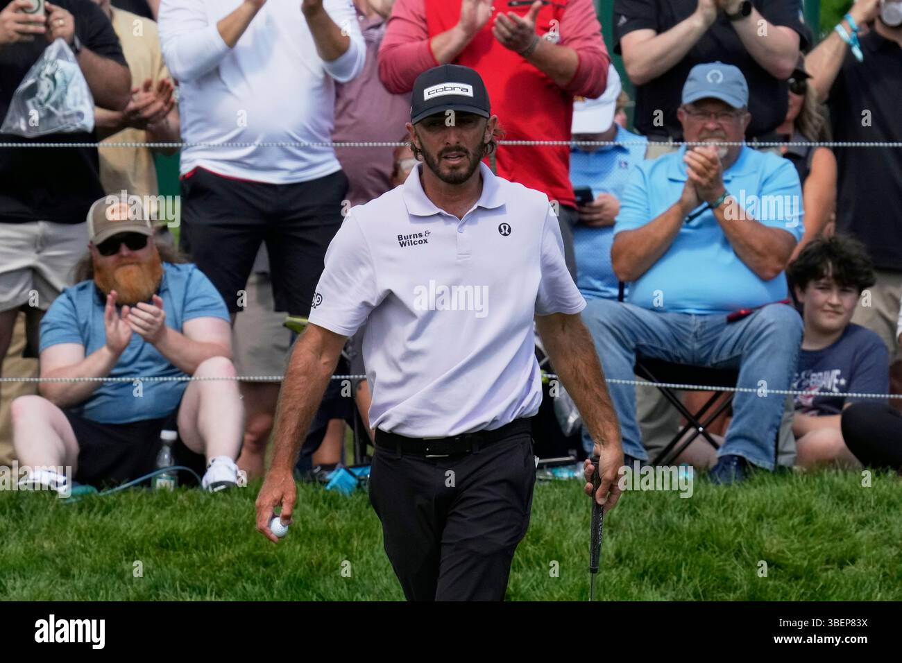 Max Homa gestures after his putt on the 18th green in the first round of the Memorial golf ...