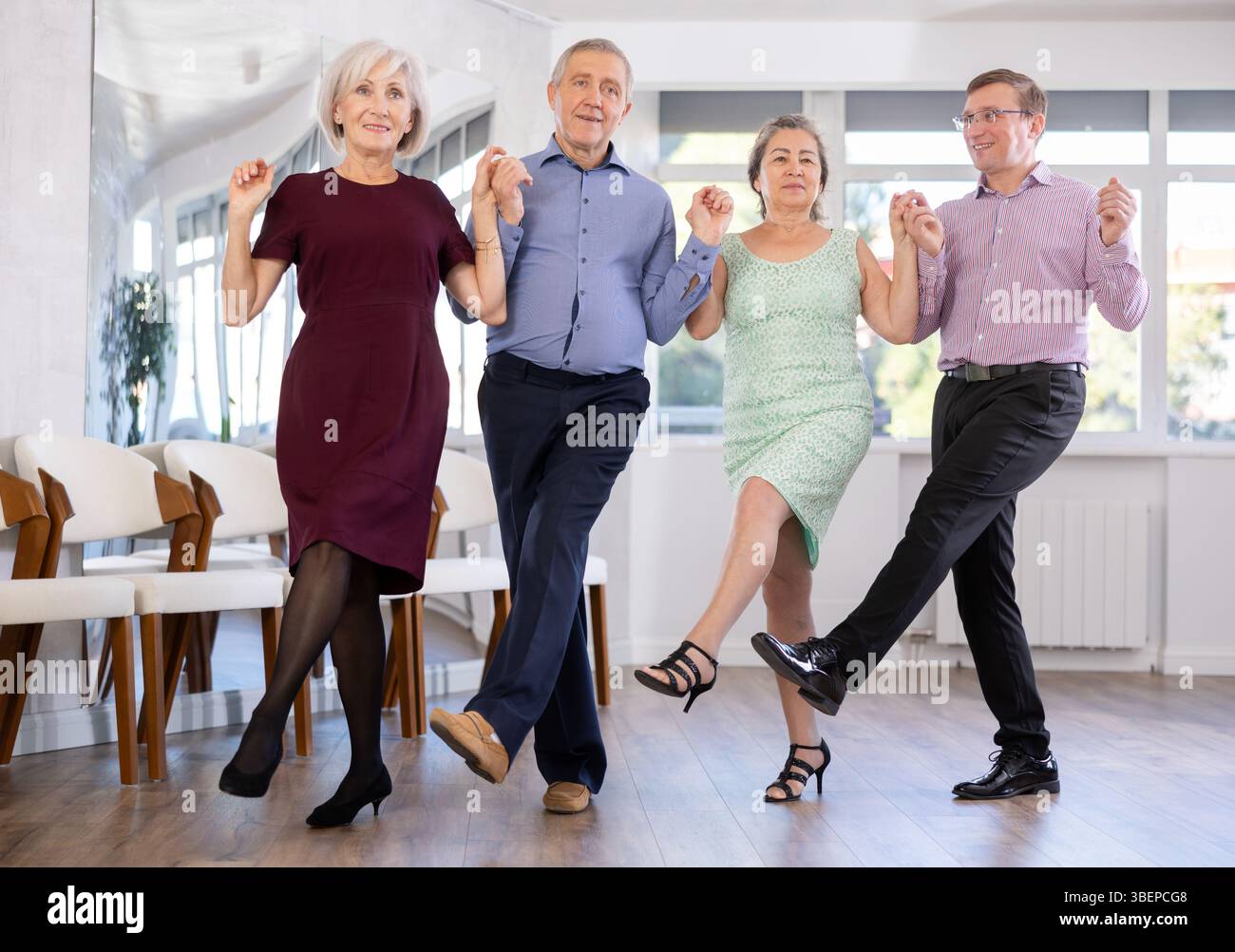 Group of men and women dancing folk dance Stock Photo - Alamy