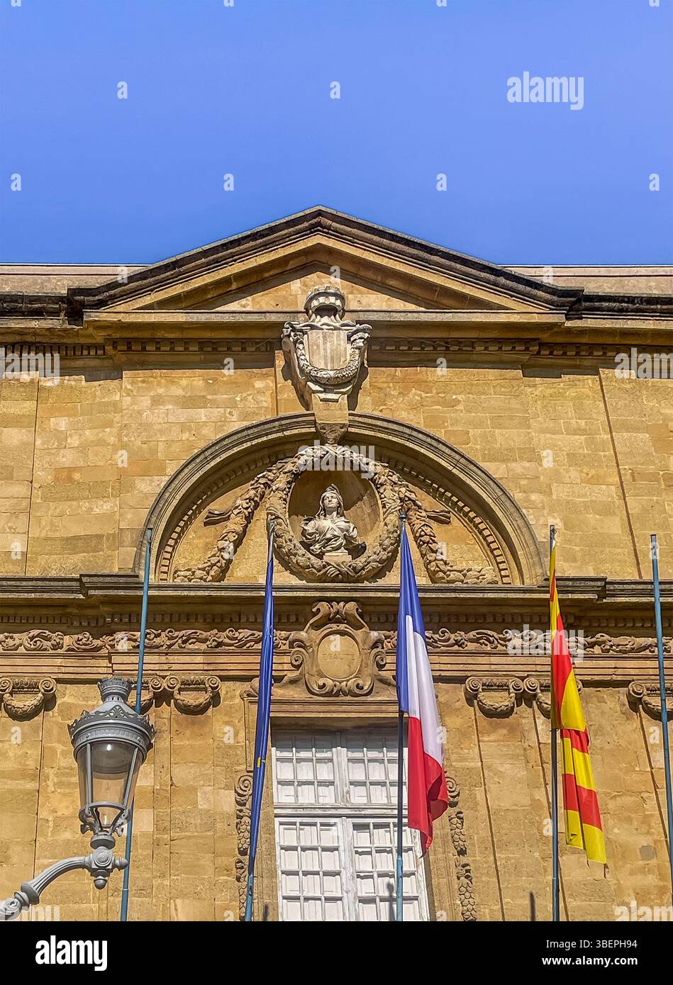 Aix-en-Provence, France - July 10, 2024: Entrance to historic yellow ...