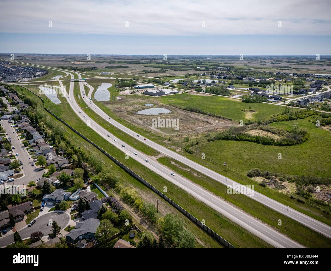 Highway with multiple lanes and a lot of cars driving on it. The road ...