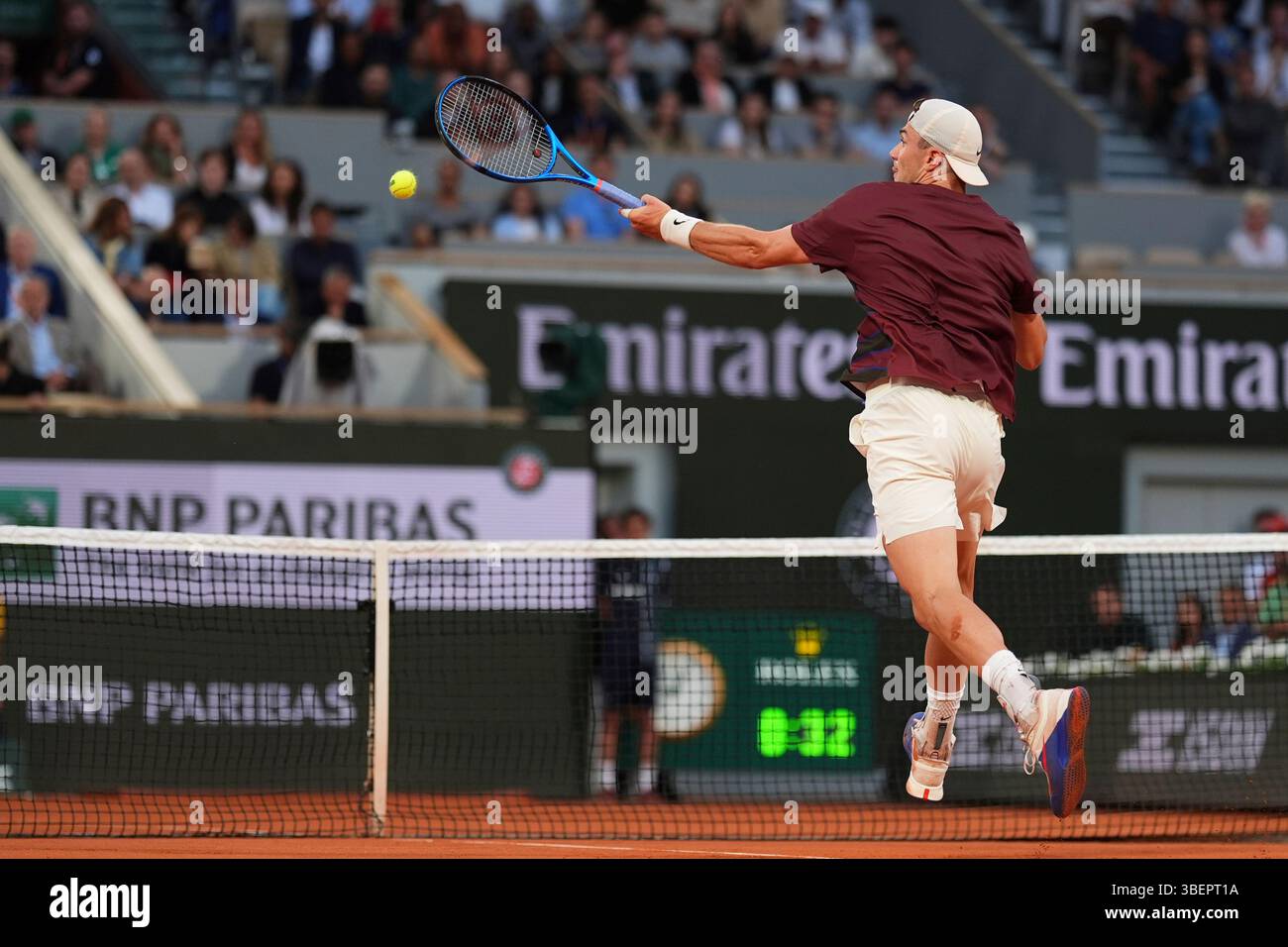 Britain's Jack Draper taps the ball over the net during a second-round ...