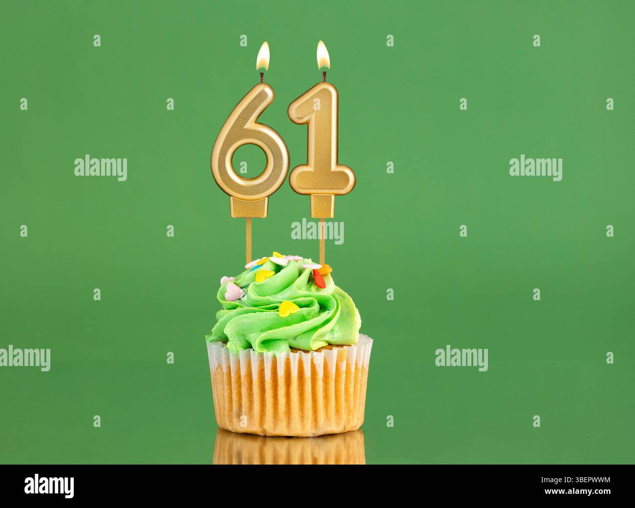 Number 61 birthday candle - Cupcake on a green background Stock Photo ...