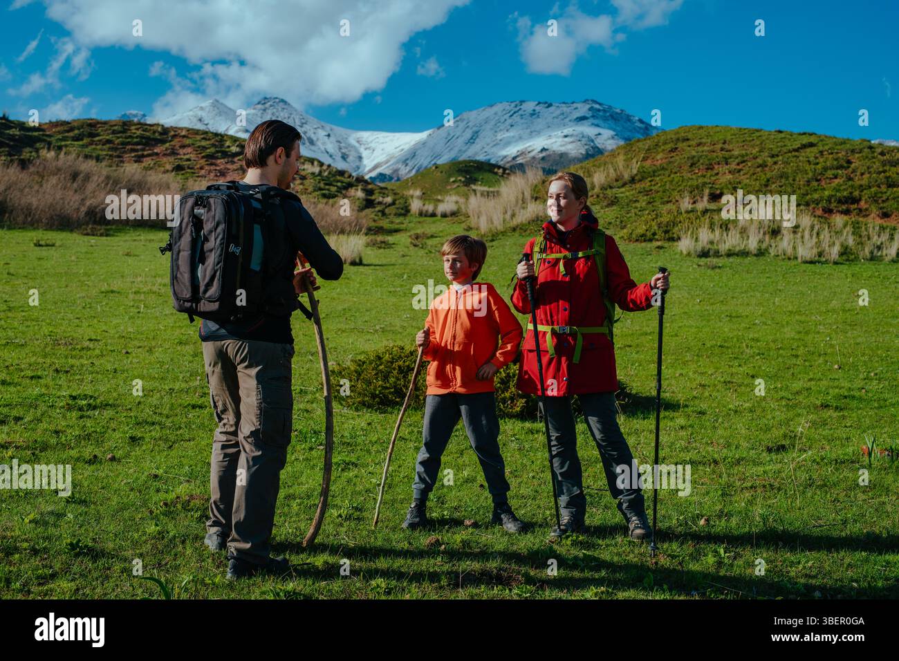 Family standing on hill hi-res stock photography and images - Alamy