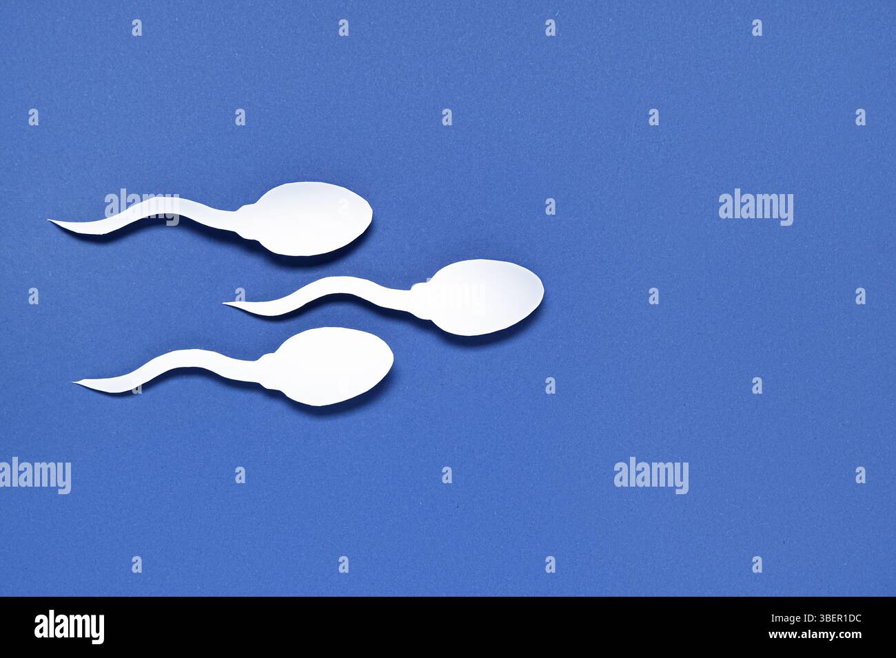Sperm cells on blue background Stock Photo - Alamy