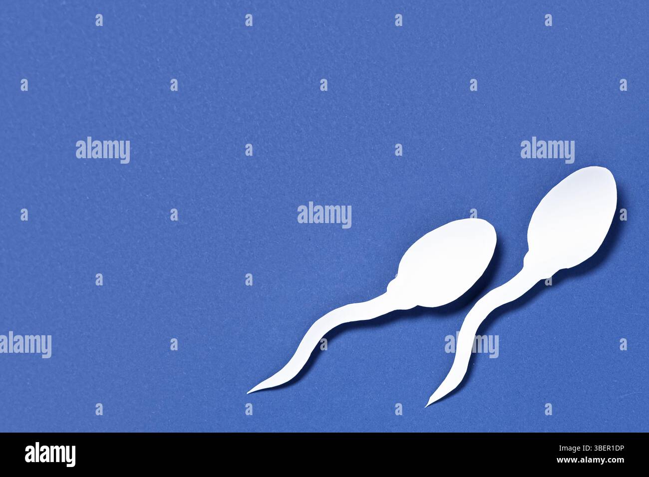 Sperm cells on blue background Stock Photo - Alamy