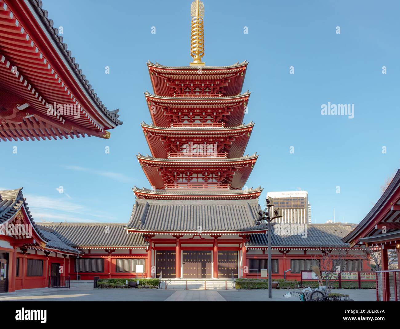 Famous tall pagoda and colorful red and green wood traditional Buddhist ...