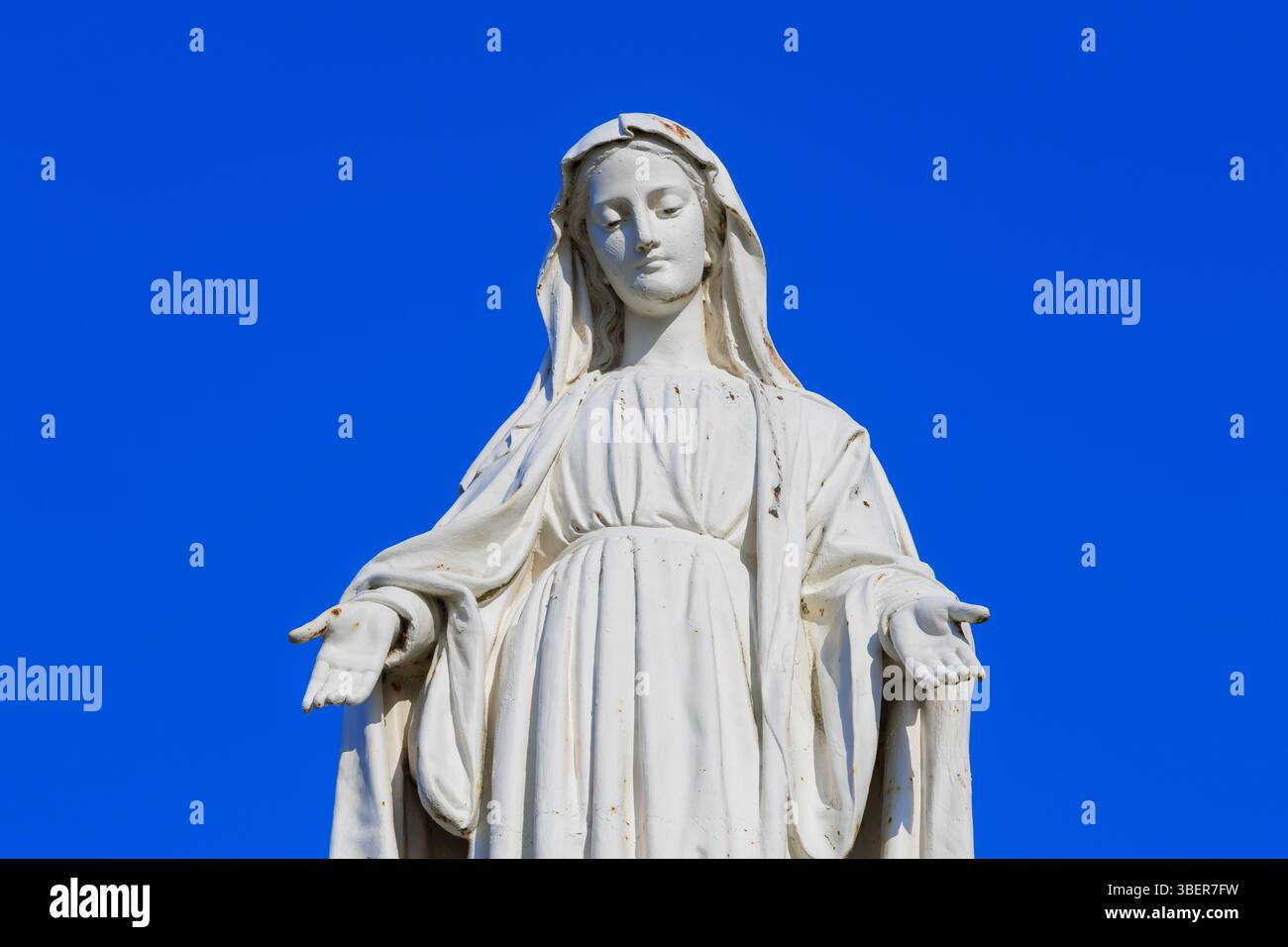 A statue of Mary, mother of Jesus at the D-Day 75 Garden in Arromanches ...