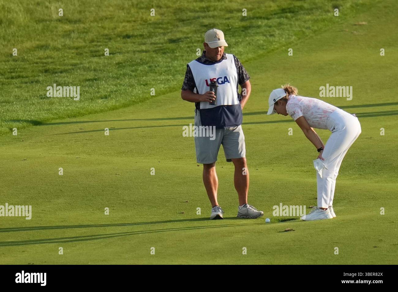 Chiara Tamburlini, of Switzerland, looks at her ball on the eighth hole ...