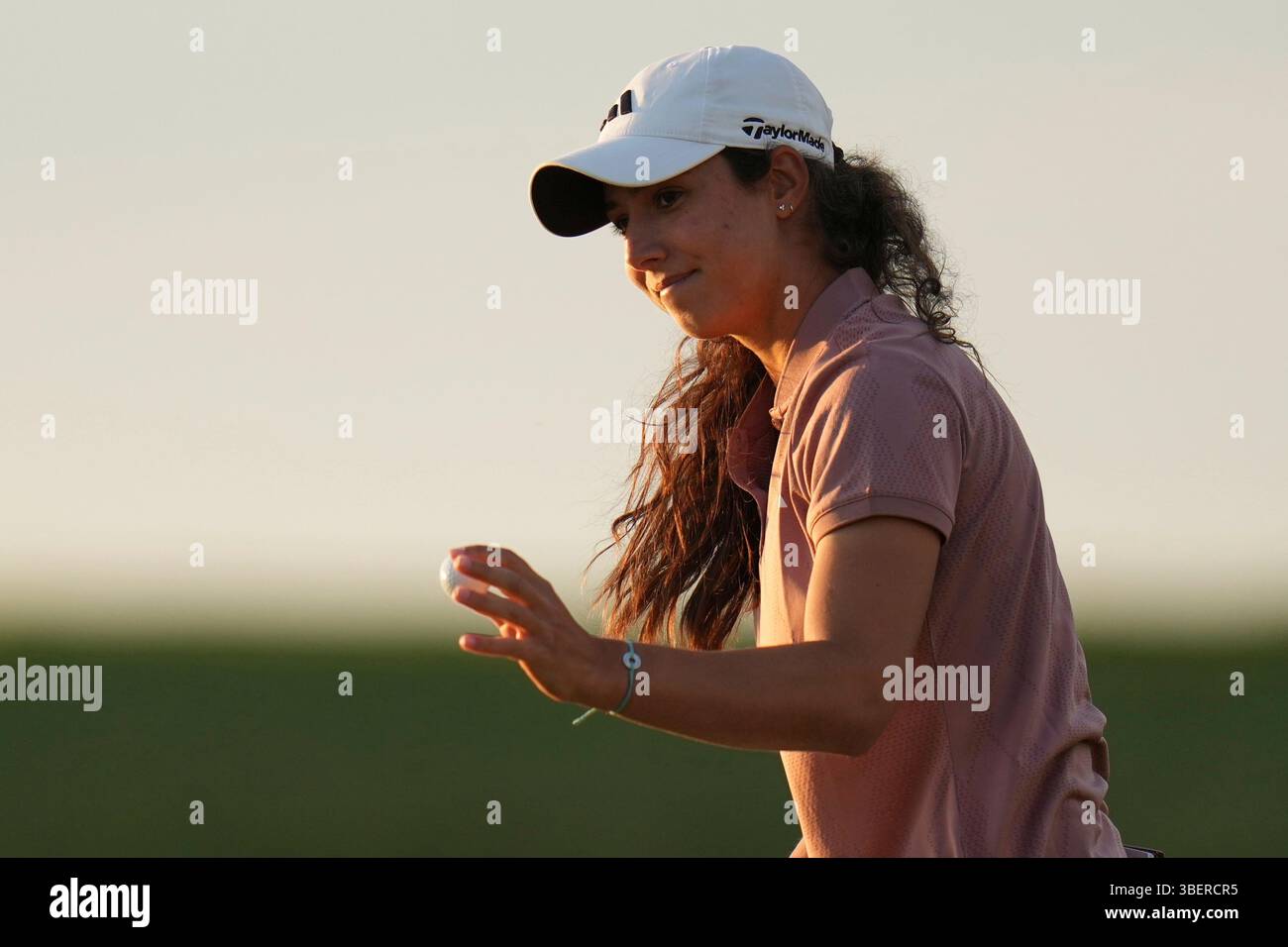 Julia Lopez Ramirez, of Spain, reacts after her putt on the ninth hole ...