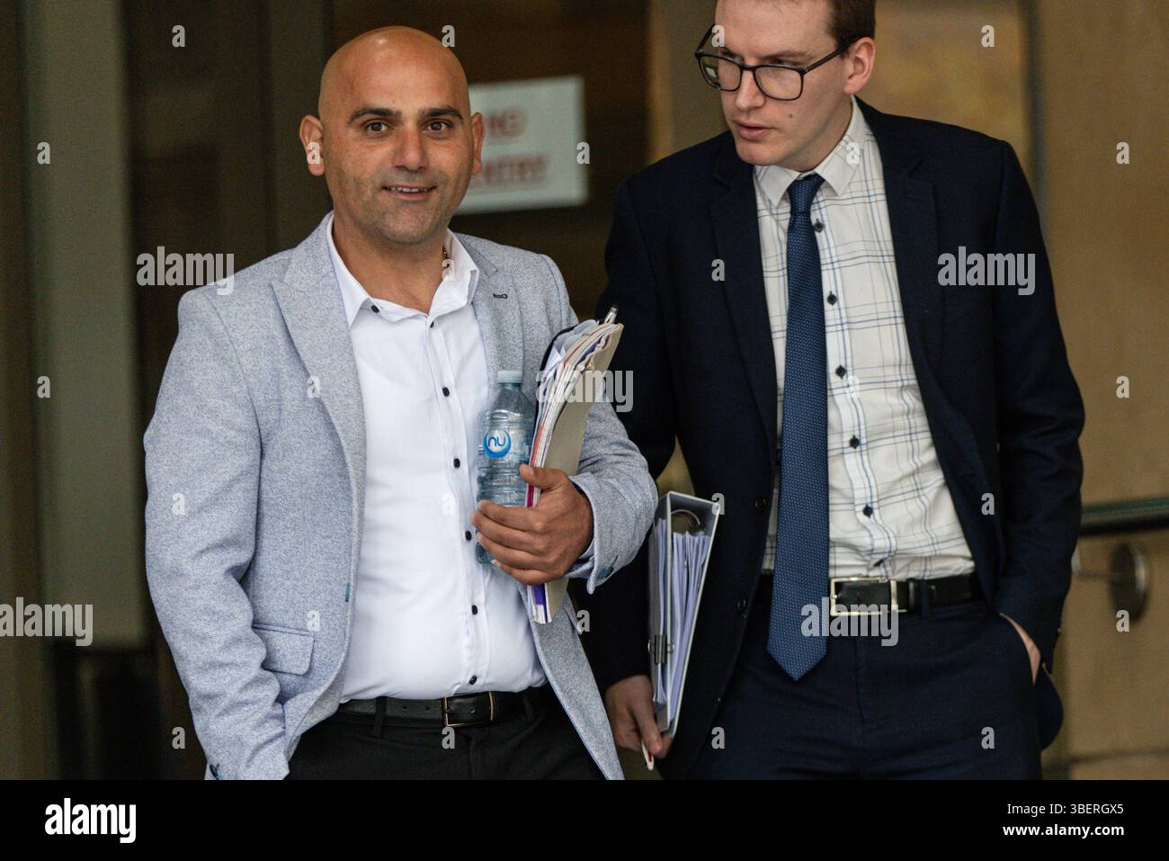 Paul Matei (left) departs from the Melbourne Magistrates Court in ...