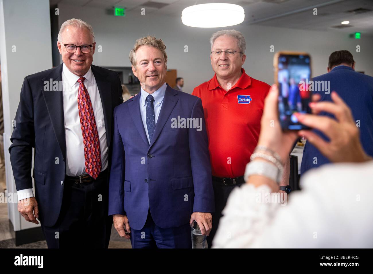 Sen. Rand Paul, R-Ky., second from left, takes pictures with supporters ...