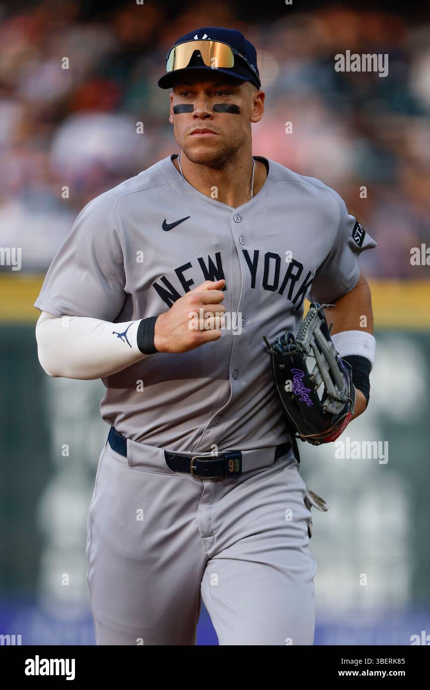 Aaron Judge #99 of the New York Yankees jogs to the dugout during a ...