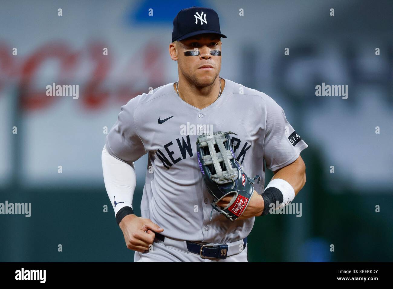 Aaron Judge #99 of the New York Yankees jogs to the dugout during a ...