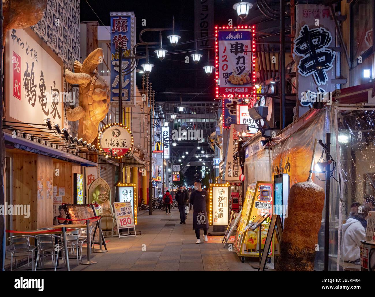 Colorful illuminated neon signs along a street at the Dotonbori ...