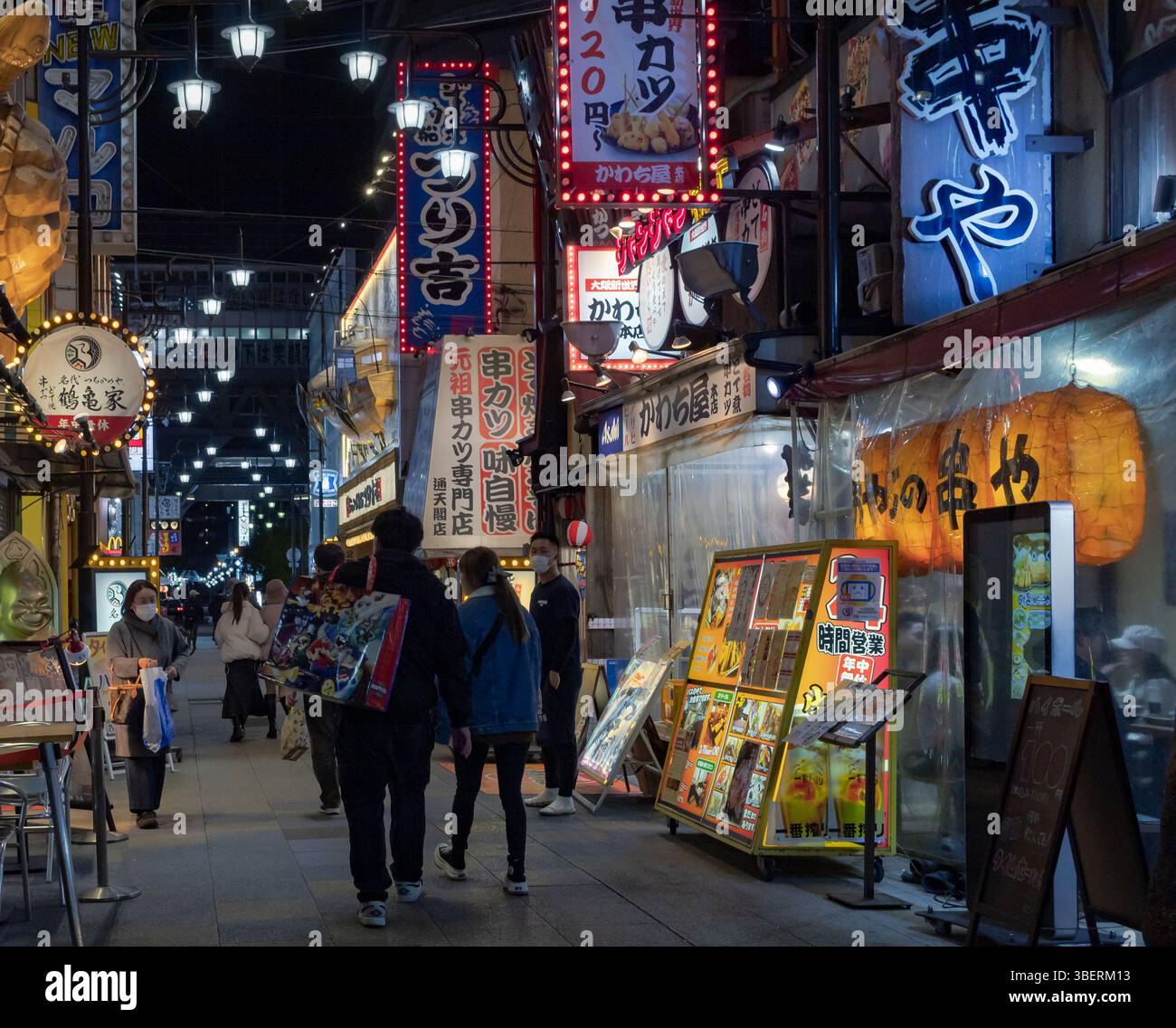 Colorful illuminated neon signs along a street at the Dotonbori ...