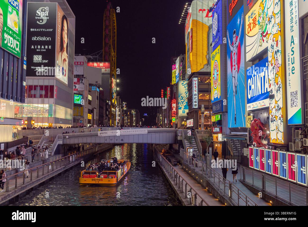 Colorful illuminated neon signs along a canal at the Dotonbori district ...