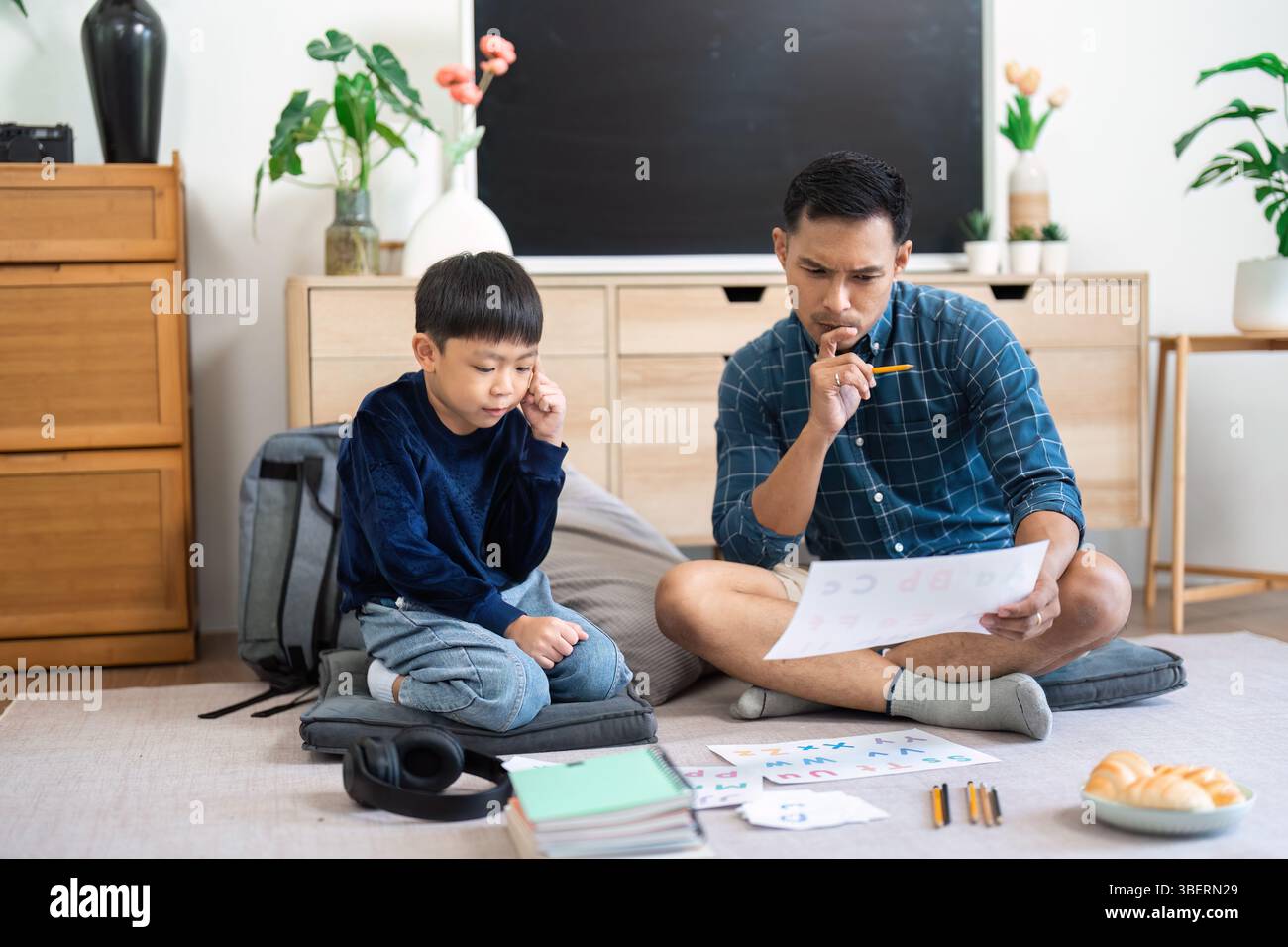Back to School and Learning Activities. A father and son focus on ...