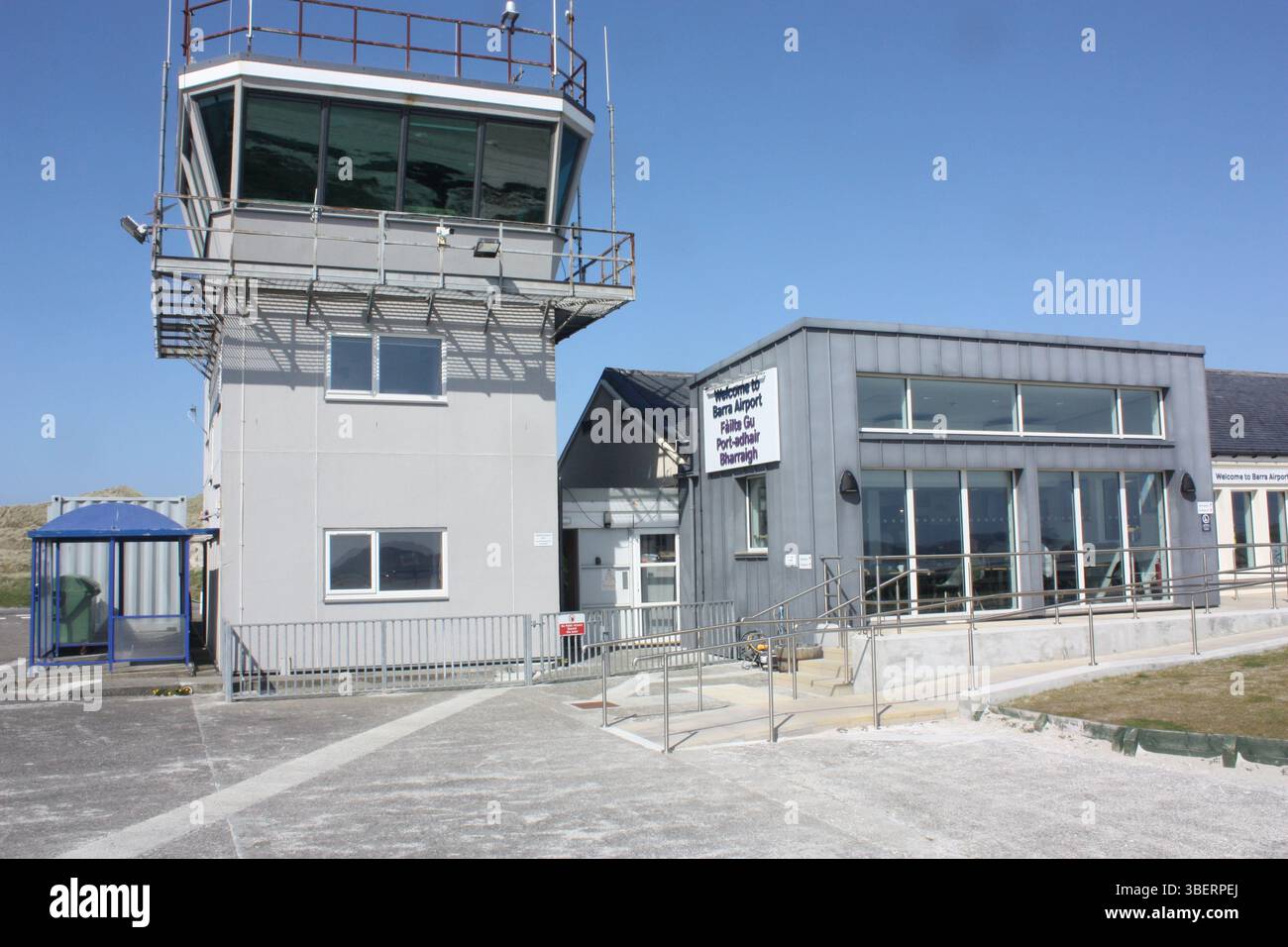 The control tower and passenger terminal at Barra airport by the beach ...
